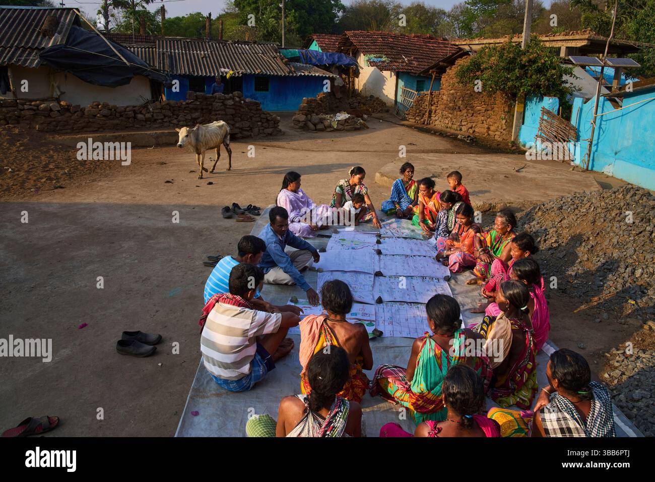 Members of Paroja Indigenous community discuss the maps they have made in Hatipakna village ...