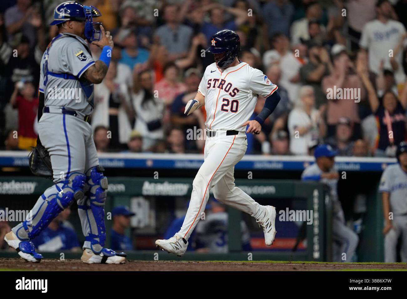 Houston Astros' Chas McCormick (20) scores on a double from Mauricio Dubón during the eighth ...
