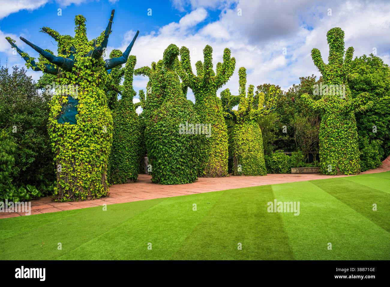 Giant tree figures in the Surrealist Garden at Hamilton Gardens ...