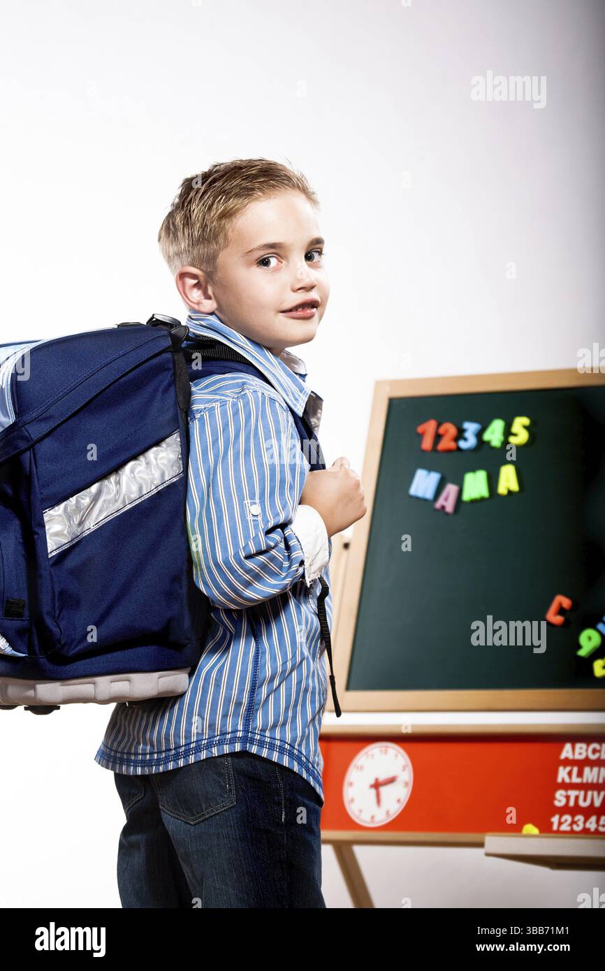 A first grader school boy with school bag Stock Photo - Alamy