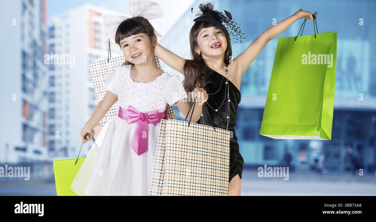 Cute little girl in big wear with packages isolated on white Stock ...