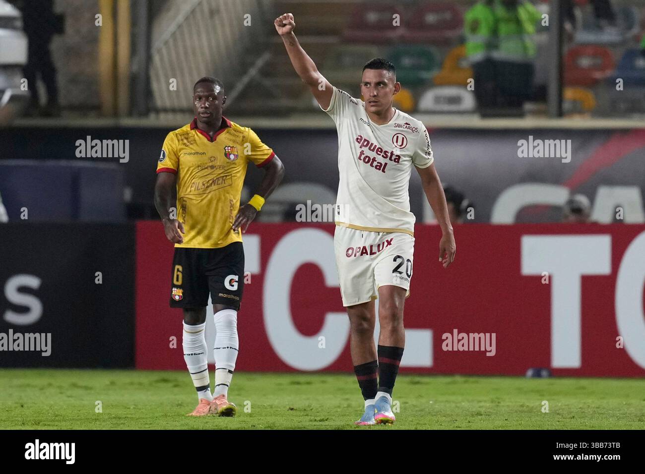 Alex Valera of Peru's Universitario de Deportes, right, celebrates ...