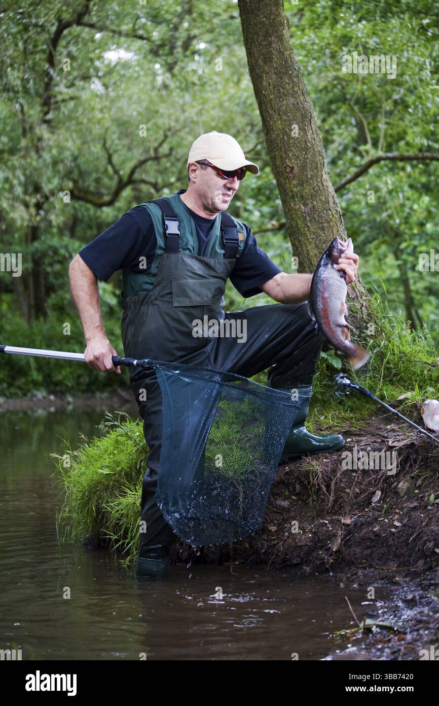 A angler fishing in the river Stock Photo - Alamy