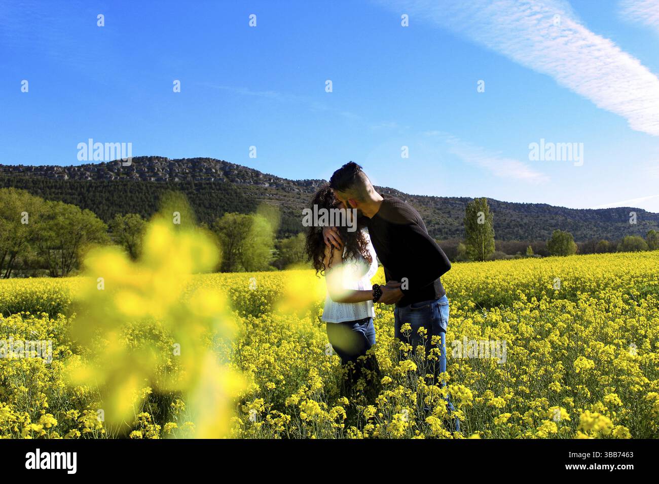 Young couple kisses in flowering hi-res stock photography and images ...