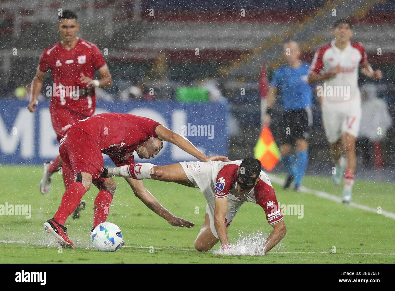 Daniel Bocanegra of Colombia's America, left, and Leonardo Sequeira of Argentina's Huracan ...