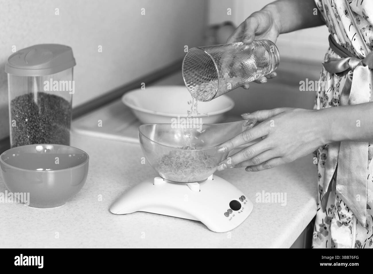 Woman on scale in Black and White Stock Photos & Images - Alamy