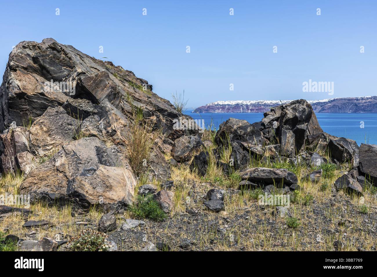 Lava scree, view from the volcanic island of Nea Kameni to the caldera ...