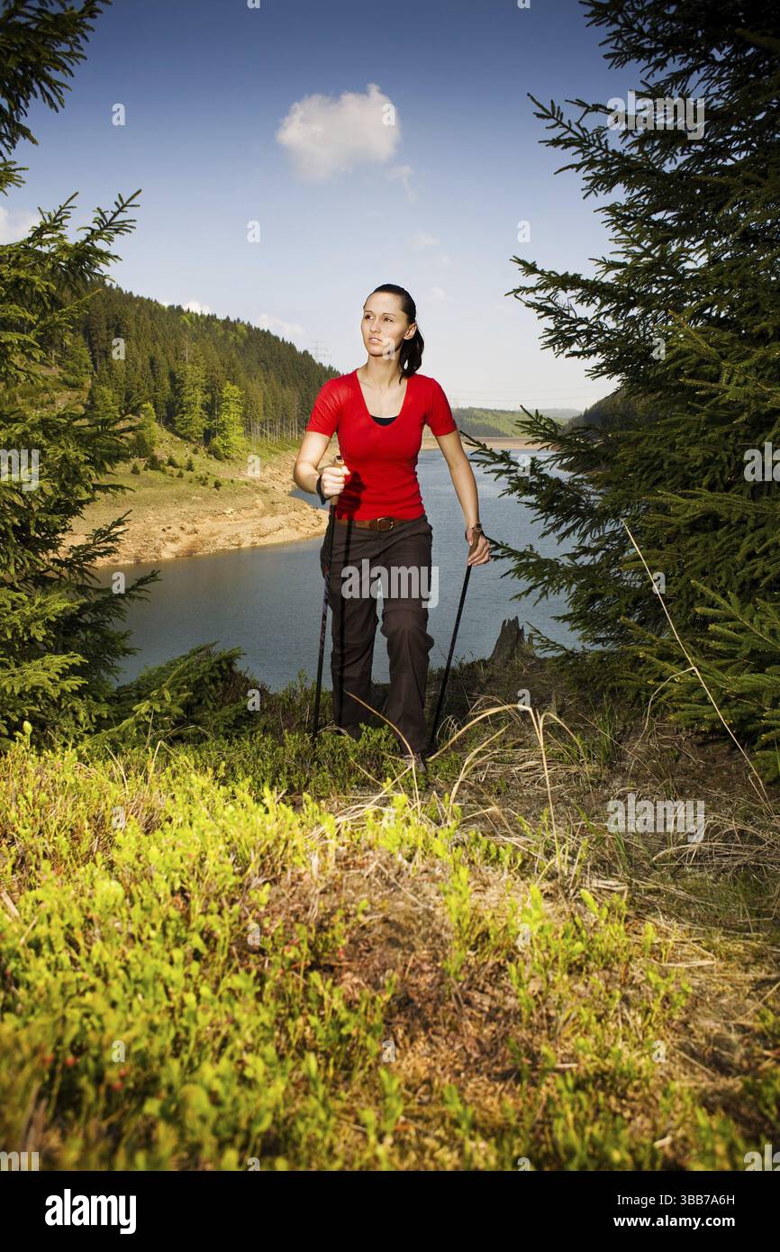 Hiking woman in front of wilde nature Stock Photo - Alamy