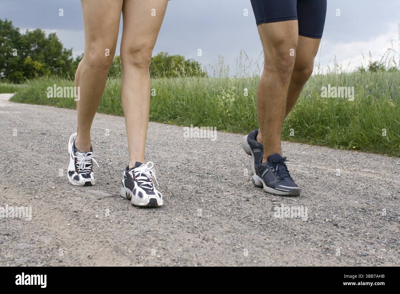 A running man and woman on a road, Coburg Stock Photo - Alamy