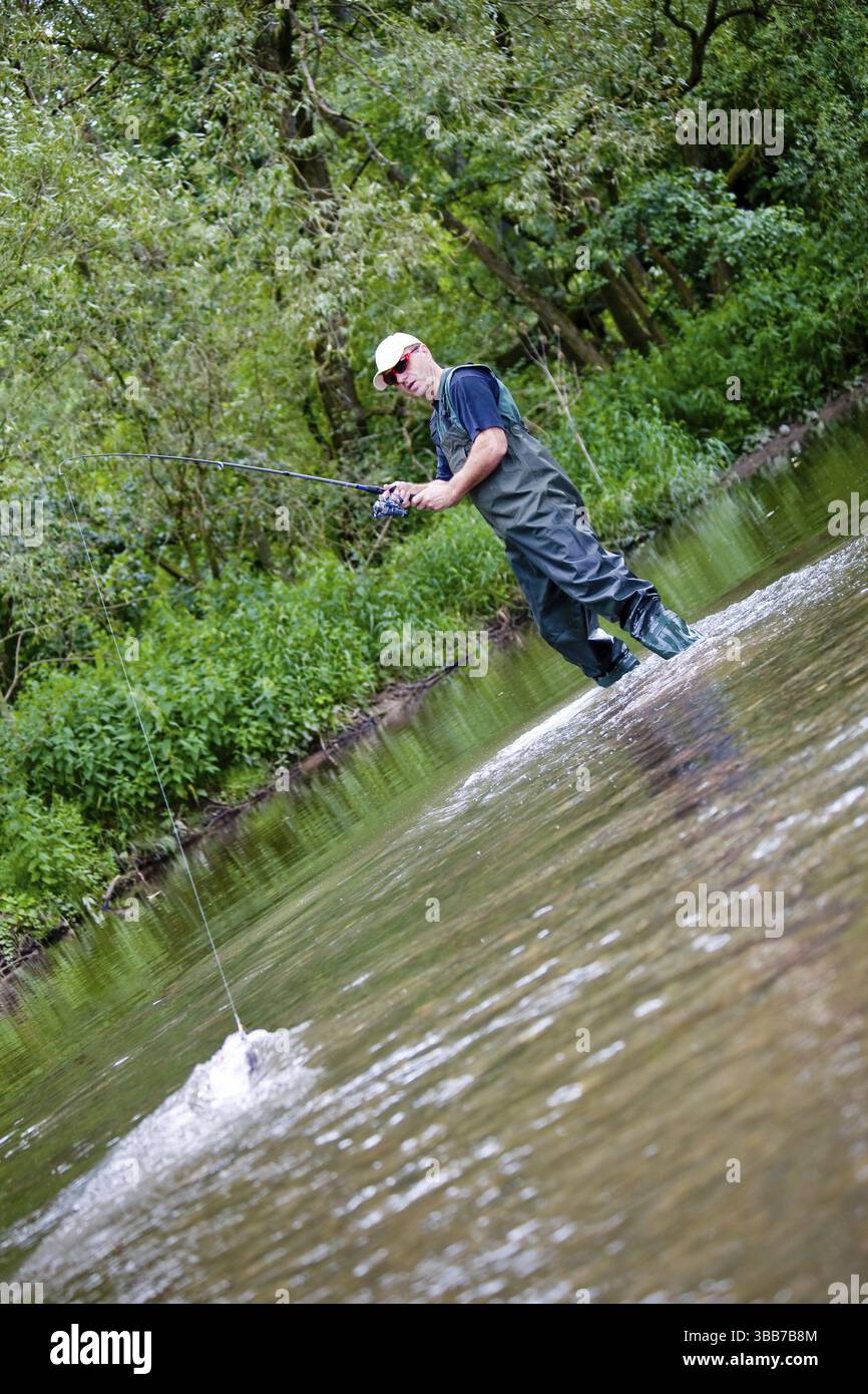 A angler fishing in the river Stock Photo - Alamy