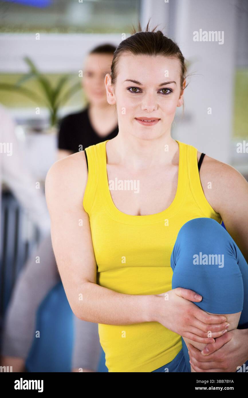 Young woman exercising in a step aerobics class Stock Photo - Alamy