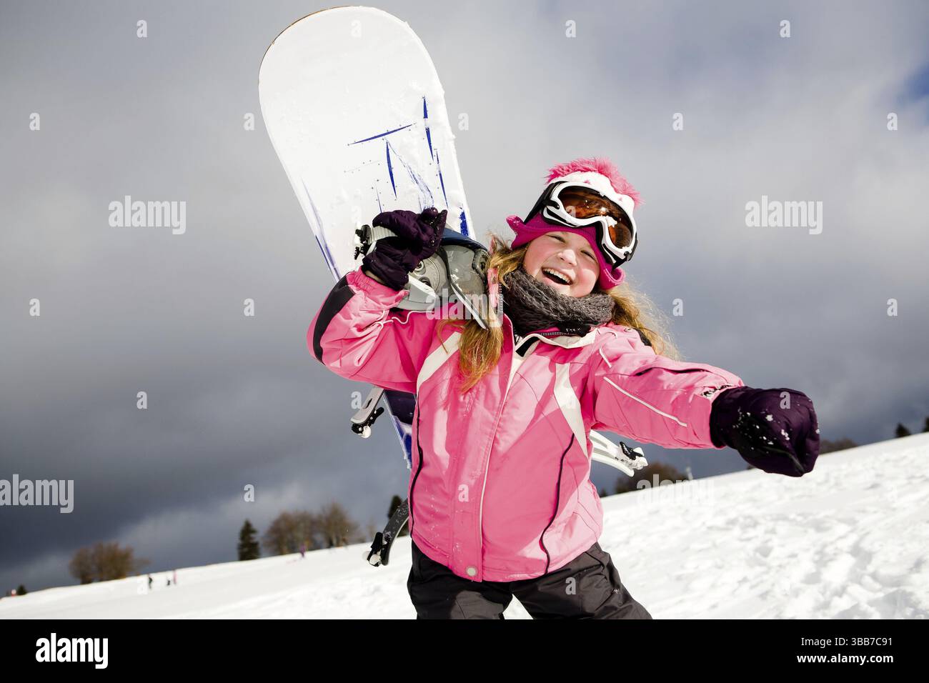 A young girl snowboarding in the Alps, outdoor shoot Stock Photo - Alamy