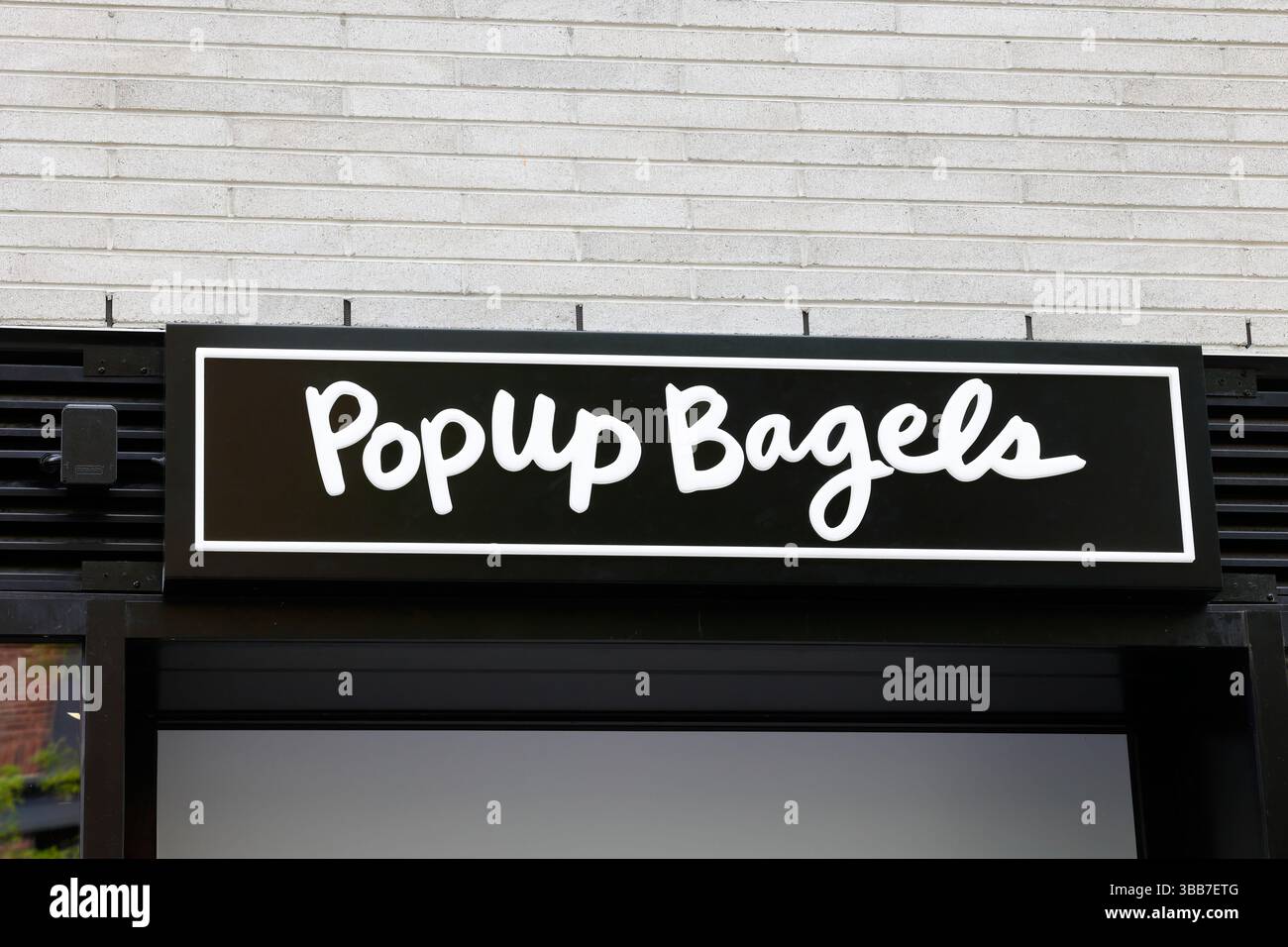 Signage for Popup Bagels a bagel shop in New York City Stock Photo - Alamy