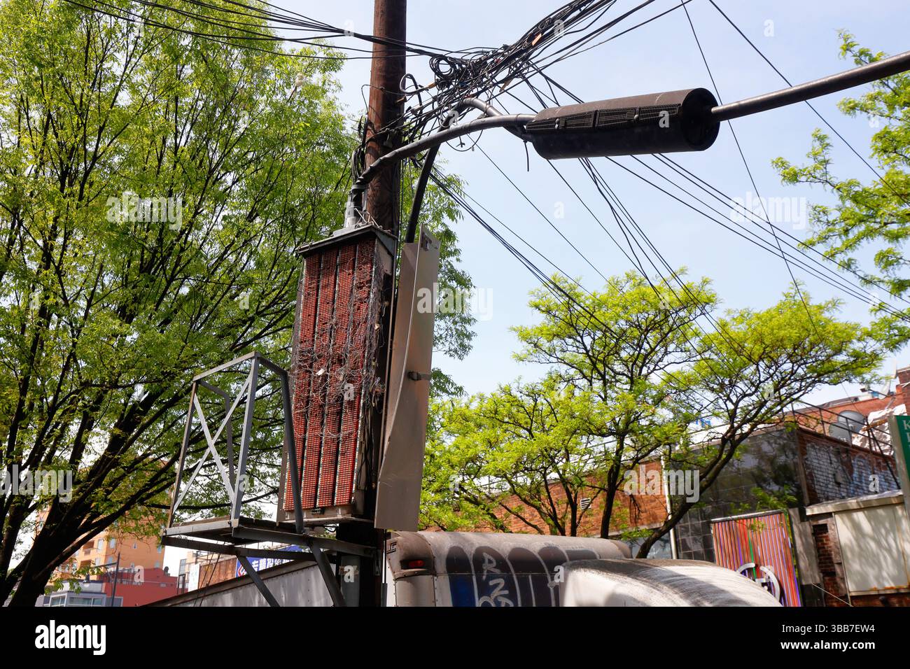 Telephone exchange box on a utility pole with wiring exposed to the ...