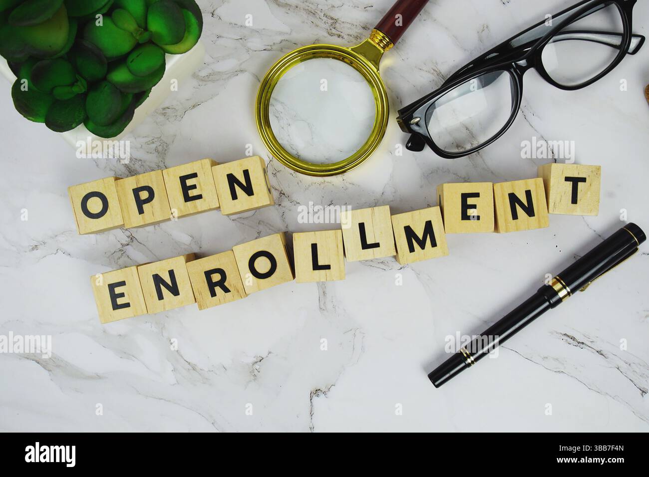Open Enrollment with wooden blocks alphabet letters and Magnifying ...