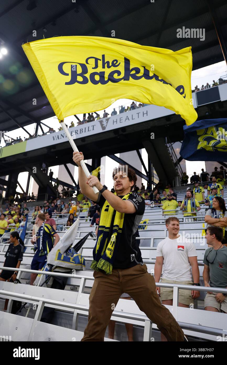 NASHVILLE, TN - MAY 14: A Nashville SC fan waves a "The Backline" flag ...