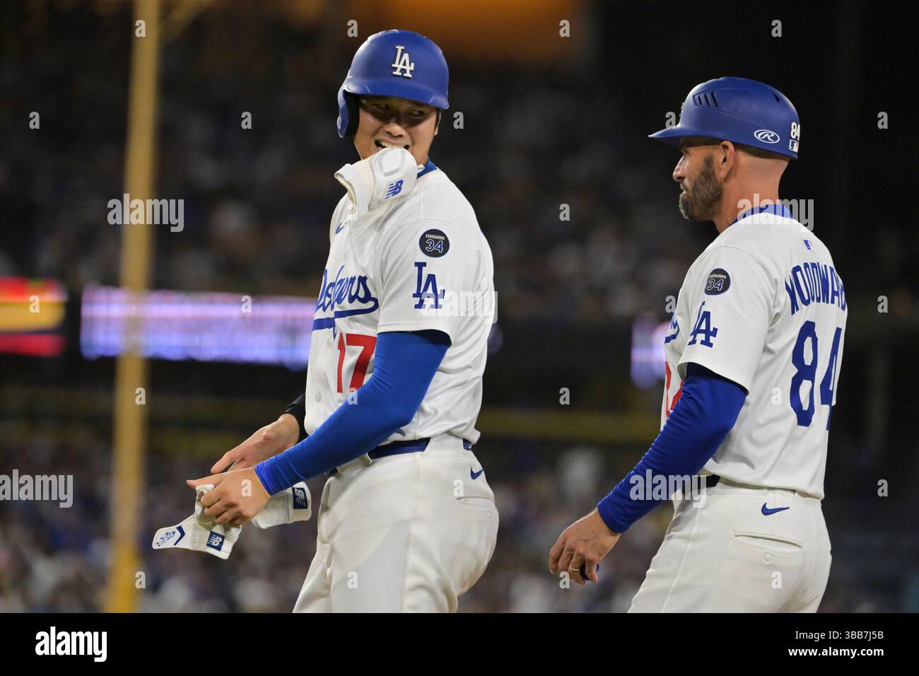 Los Angeles Dodgers' Shohei Ohtani (17) and first base coach/infield ...