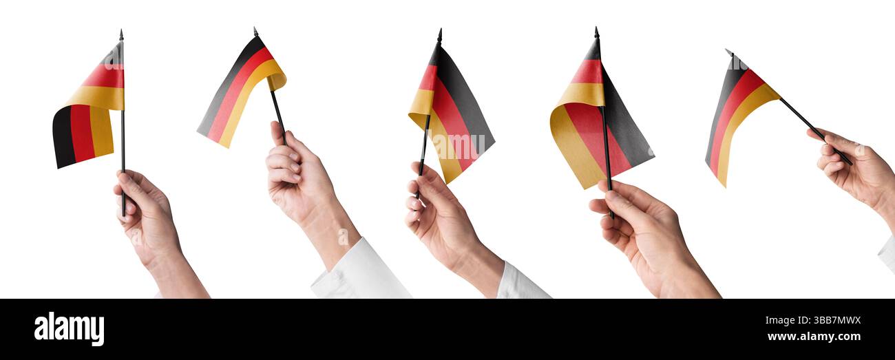 The Germany flag in hand in different angles on a white background ...