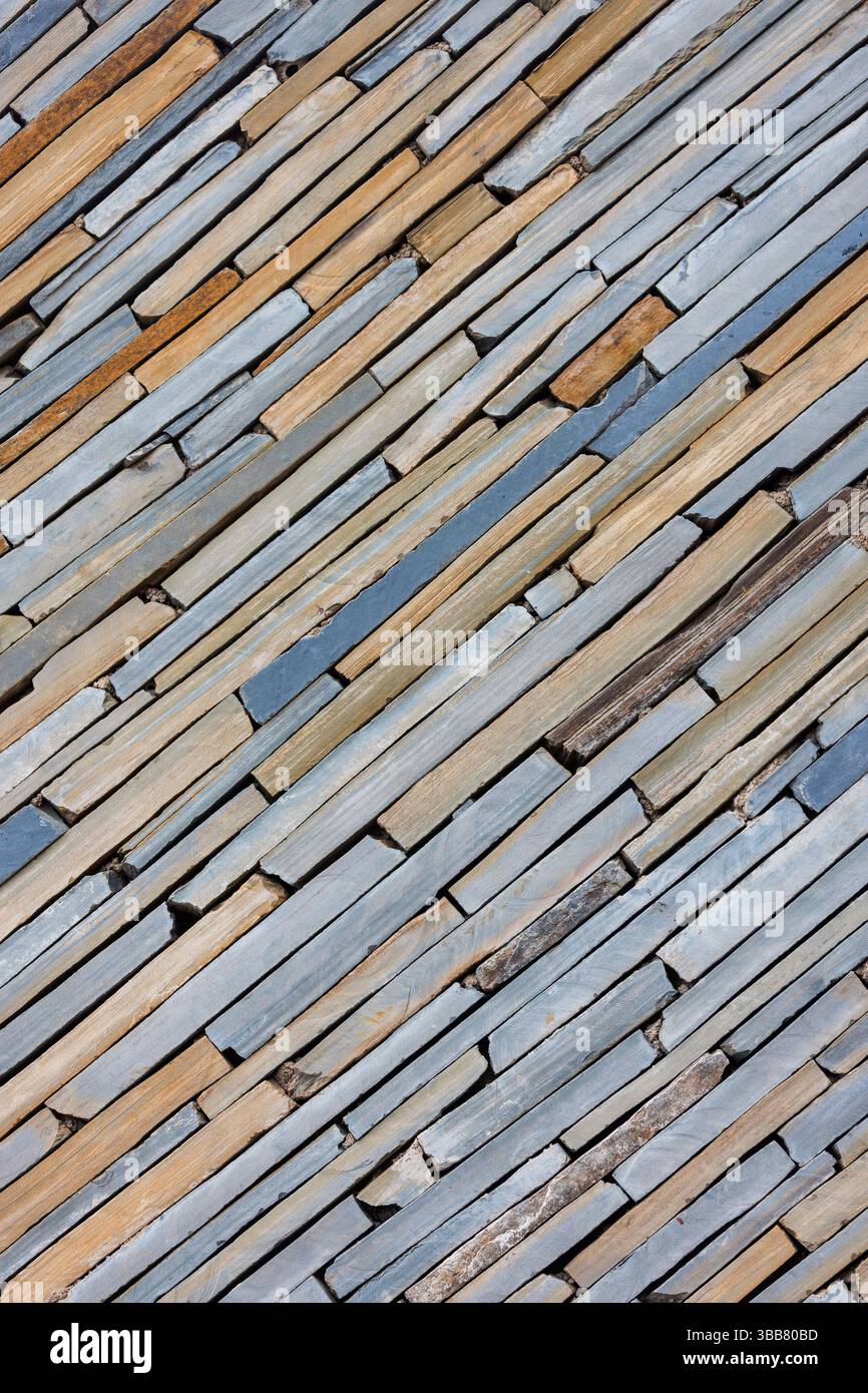 Colorful stone wall typical construction of using marble and slate ...
