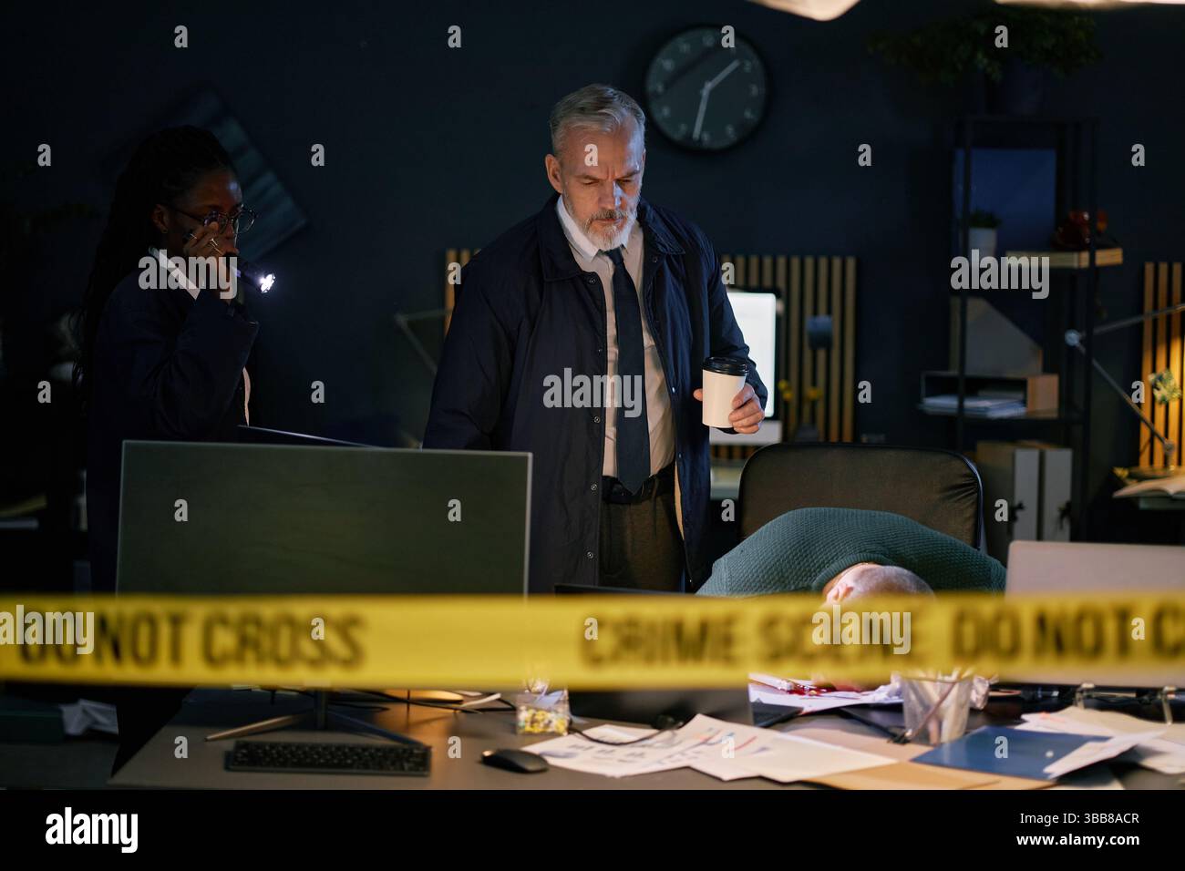 Crime scene investigation with officers examining evidence and ...