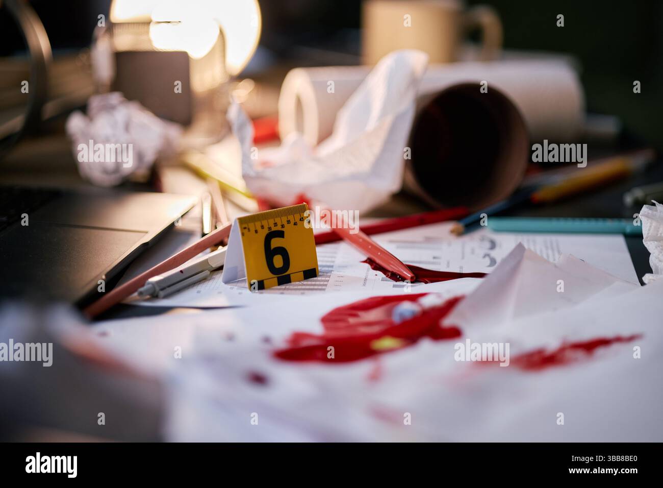 Evidence markers and various objects on desk during crime investigation ...