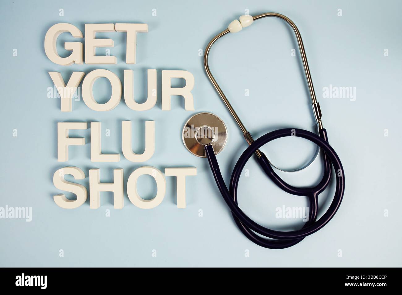 Get Your Flu Shot alphabet letters with stethoscope top view on blue ...