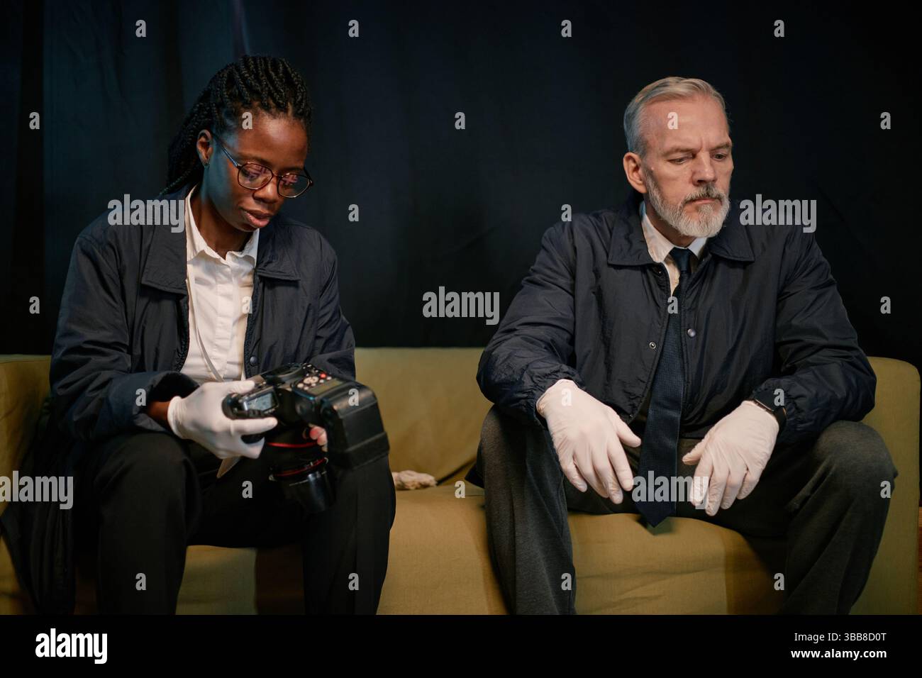 African American female and senior Caucasian male colleagues ...