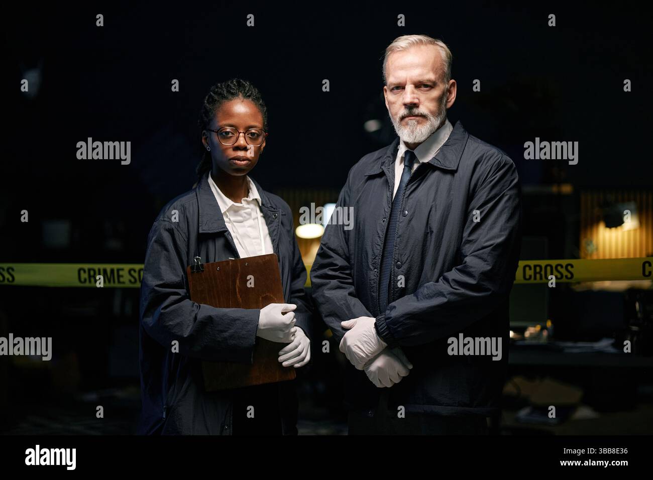 Multiracial detectives standing side by side, holding clipboard and ...