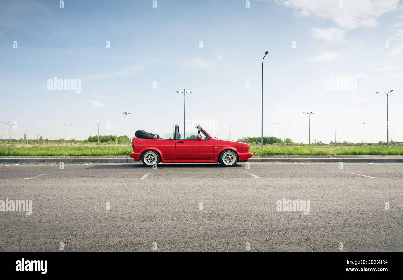 Side profile view of classic Volkswagen Golf cabriolet. Red VW golf mk1 ...