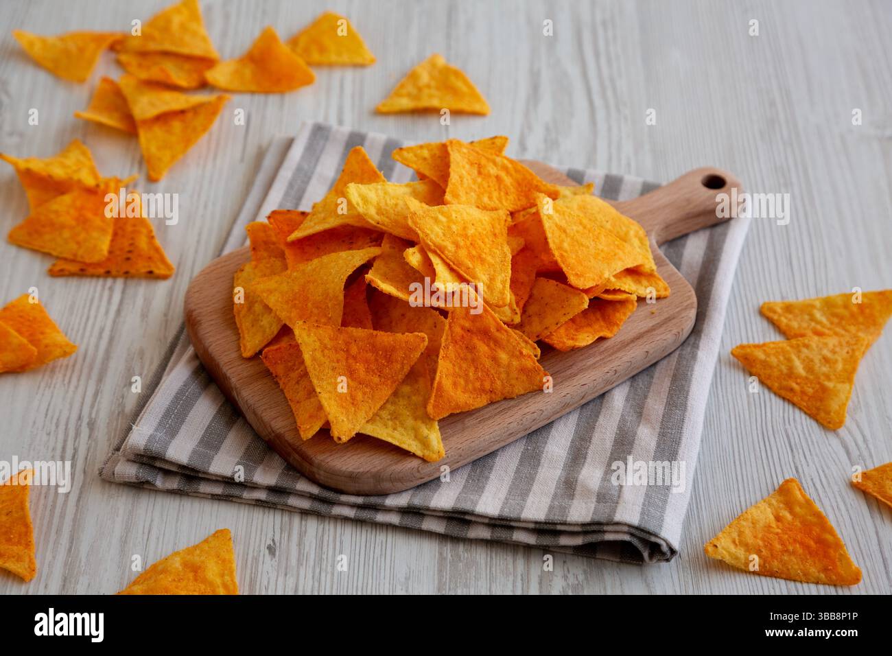 Mexican Nacho Cheese Tortilla Chips on a Board, side view Stock Photo ...