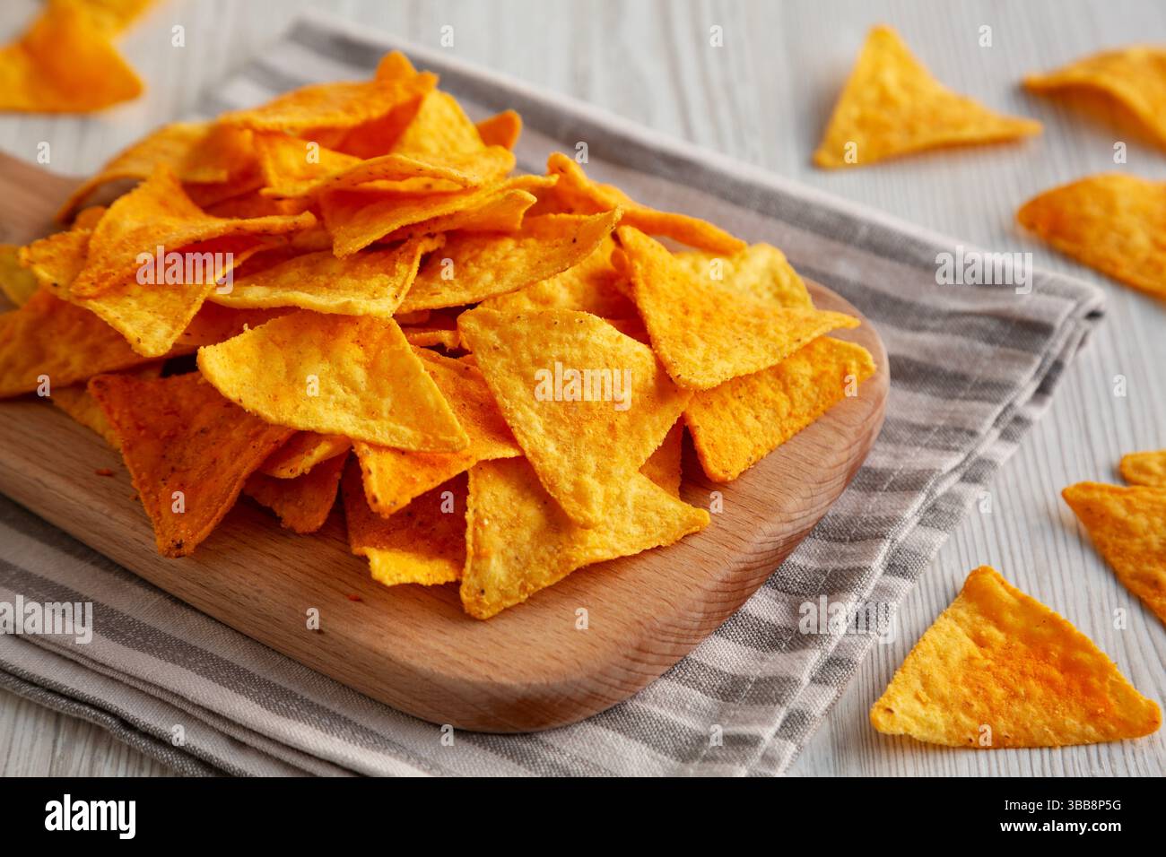 Mexican Nacho Cheese Tortilla Chips on a Board, side view Stock Photo ...