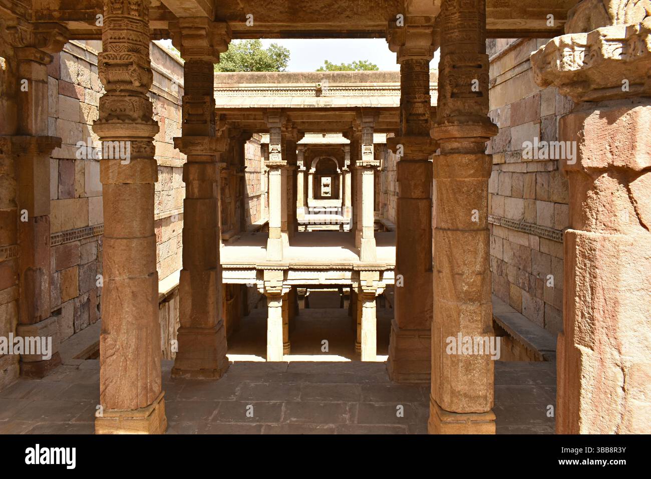 Interior view featuring stone-carved columns of Jethabhai's Stepwell ...