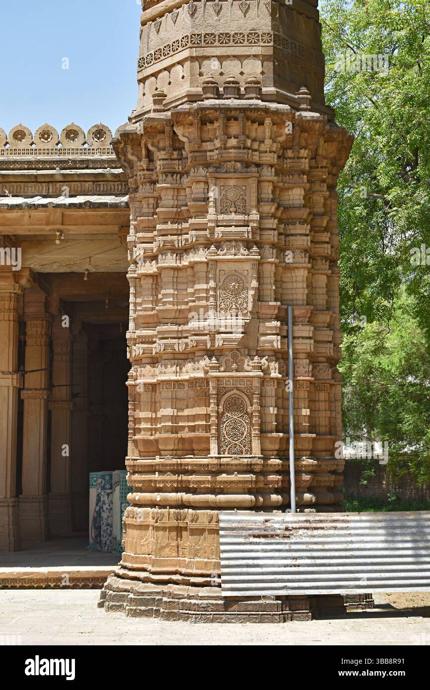 Detailed stone carvings on a minaret of the Saiyad Usman Mosque, an ...