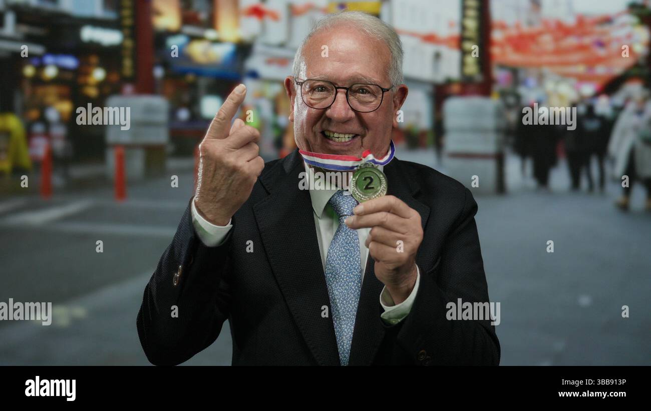 Senior man in suit making offensive gesture with middle finger while ...