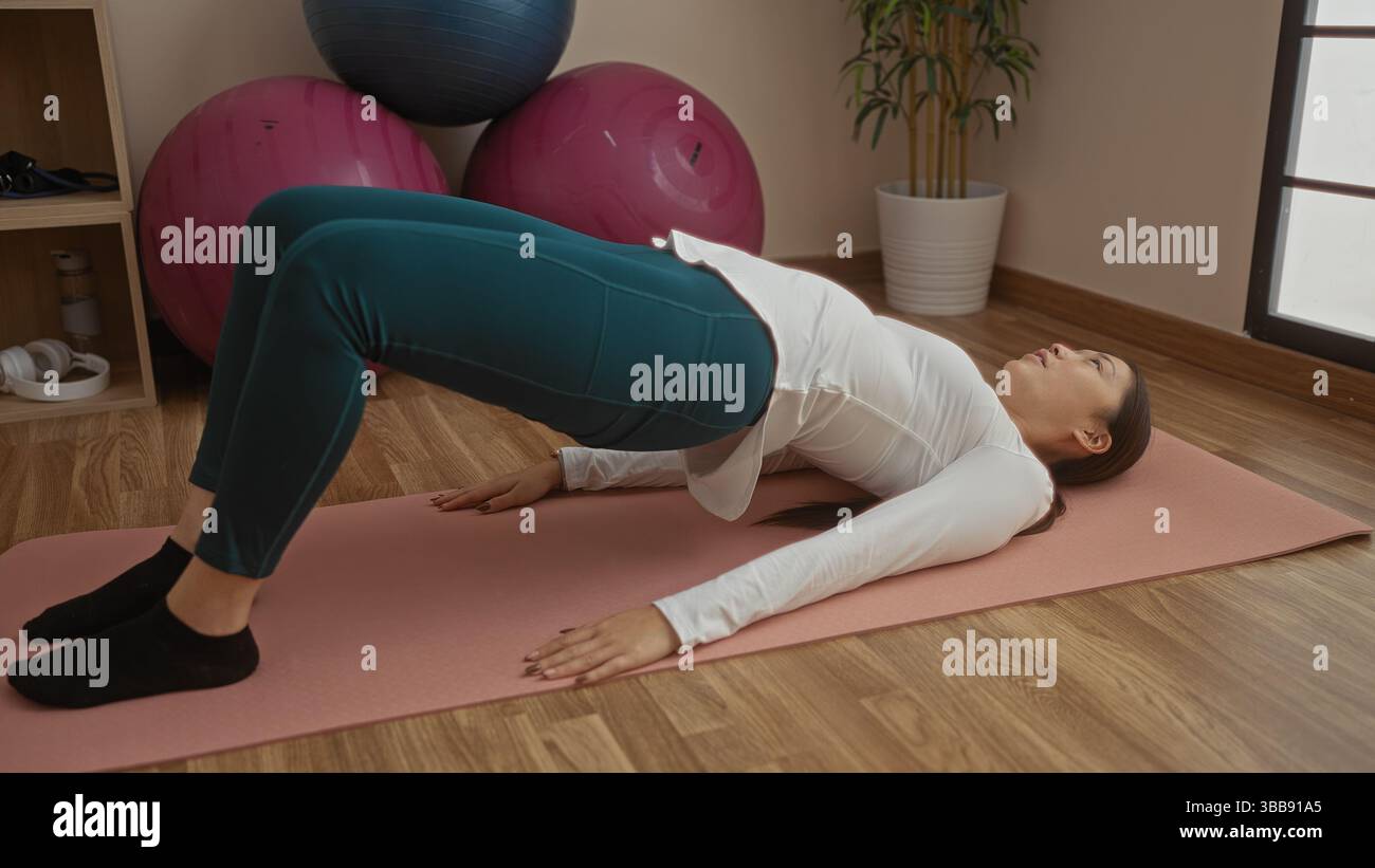 Woman demonstrating bridge pose in hi-res stock photography and images ...