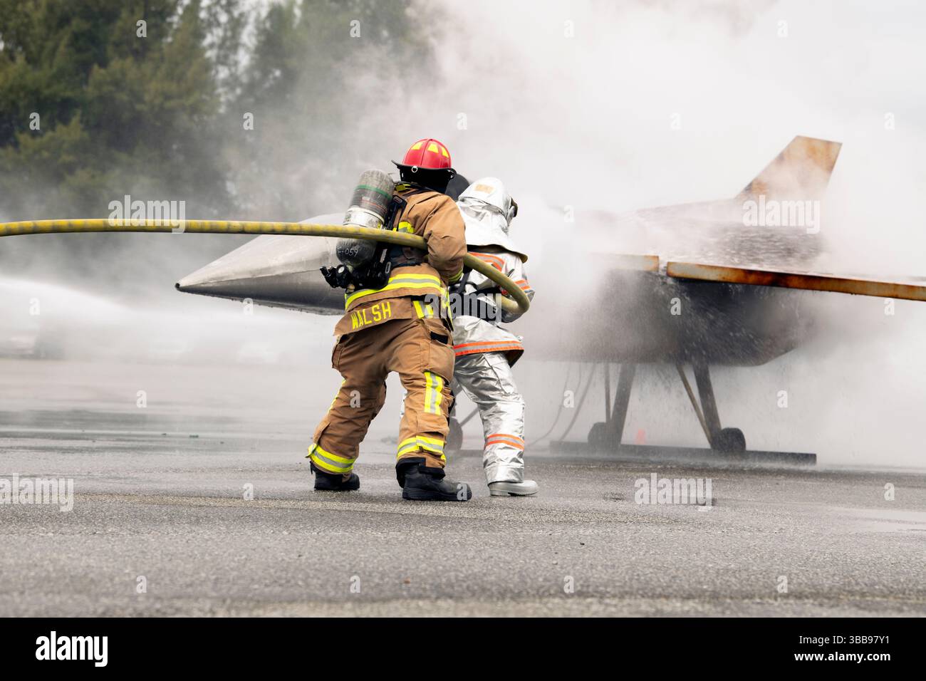 A U.S. Air Force firefighter assigned to the 18th Civil Engineer ...