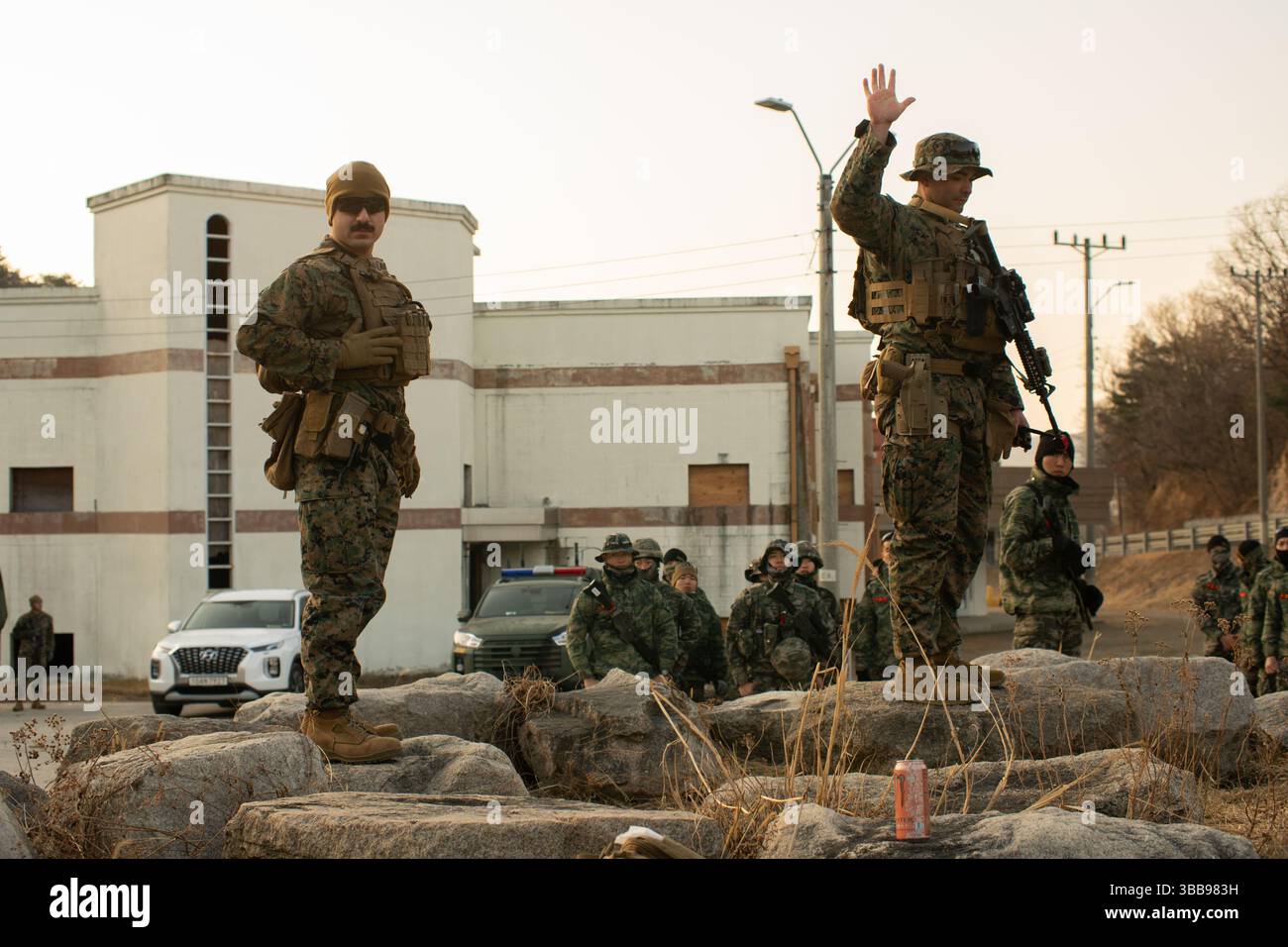 U.S. Marine Corps Sgt. Adam Vega, right, and Staff Sgt. Subhan Gasminov ...