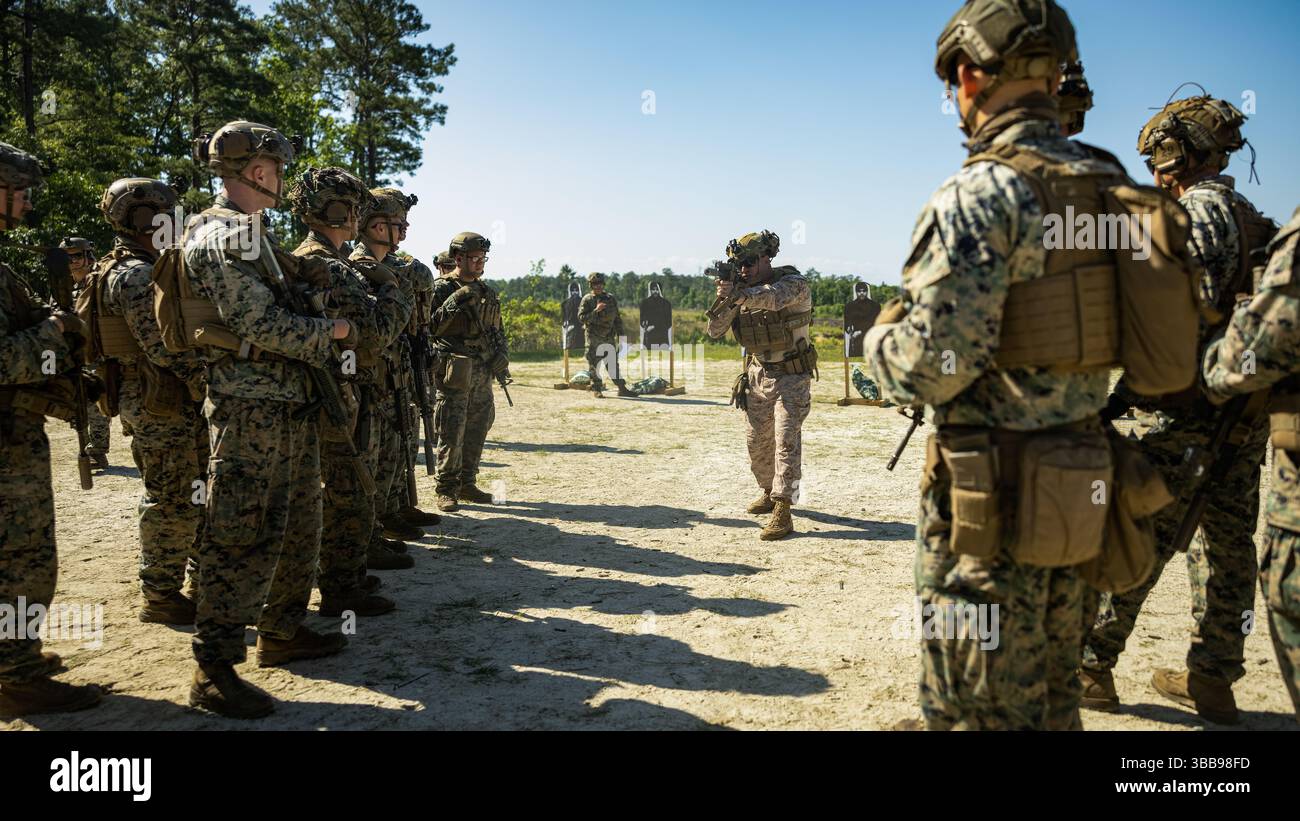 U.S. Marine Corps Chief Warrant Officer 2 Kyle Boksha, center, an ...