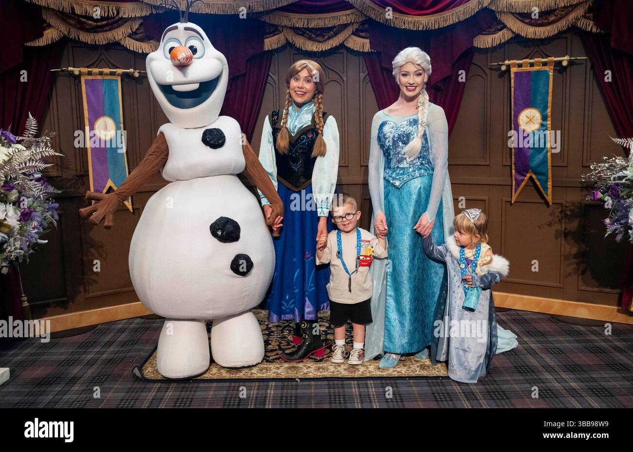 EDITORIAL USE ONLY Zac Keyworth, aged 8, meets Disney characters Elsa ...