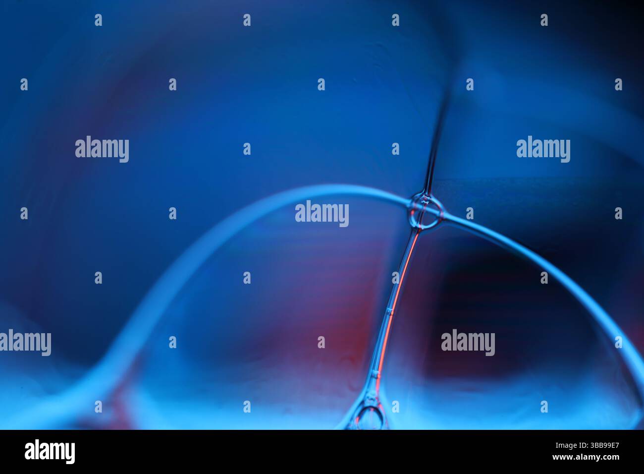 Blue reflections of liquid in macro, bright liquid surface, bubbles in ...