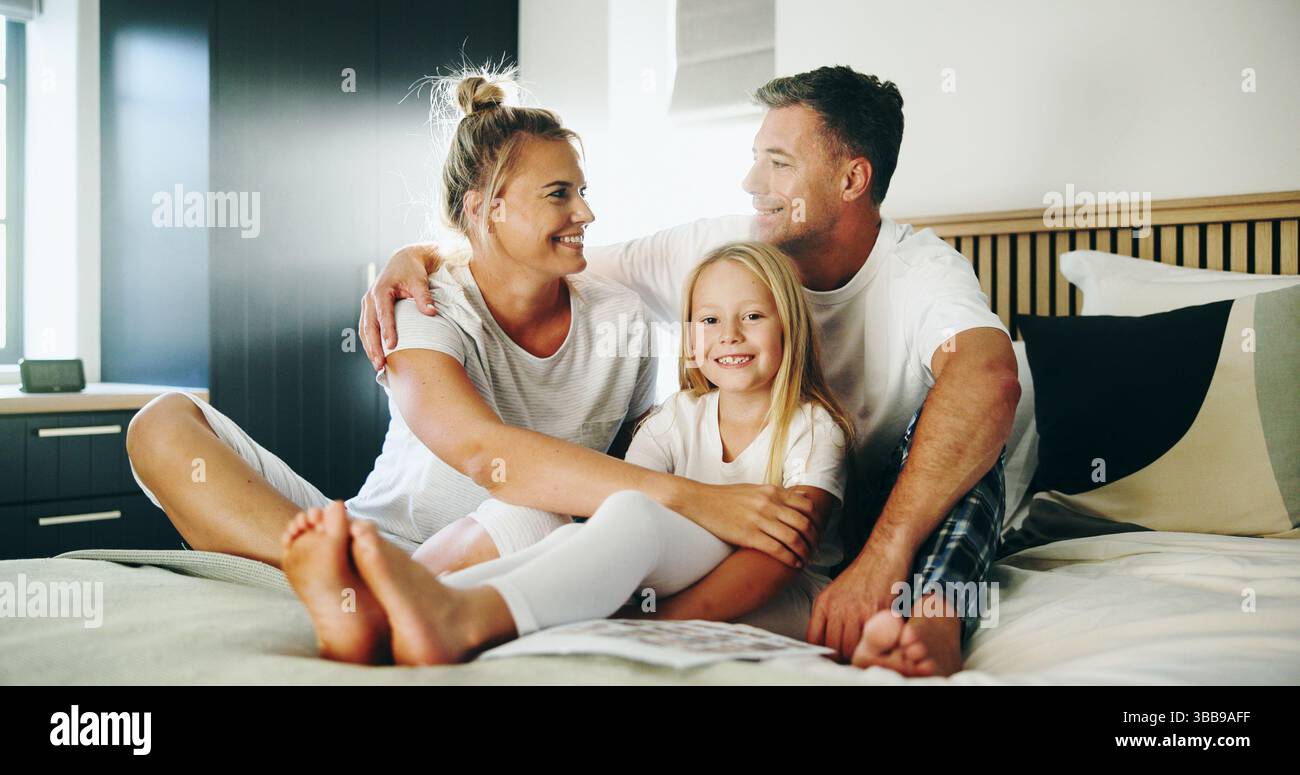 Happy, parents and hug child in bedroom for love, security and bonding together for weekend ...