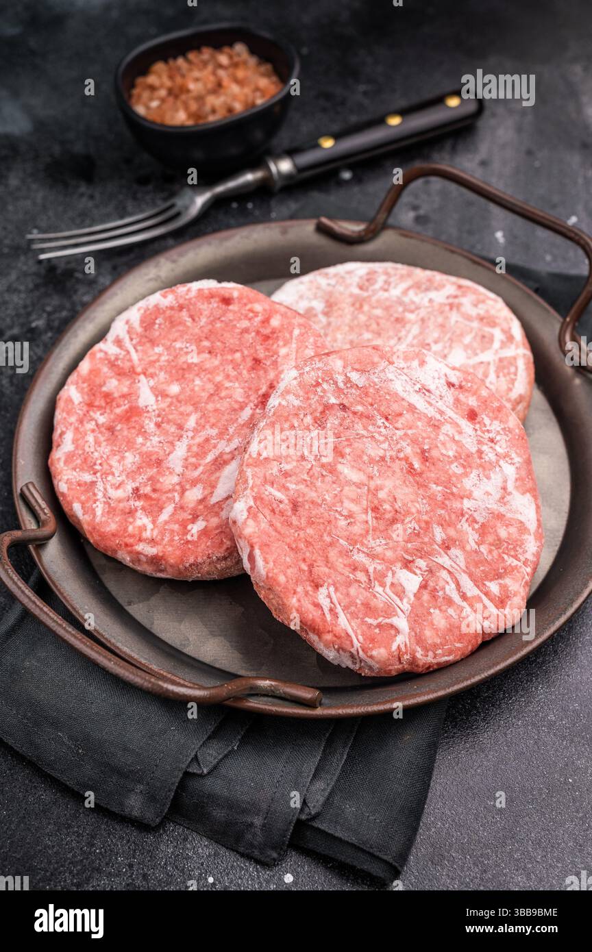 Frozen Meat cutlet, mincemeat of pork and beef for burgers. black ...