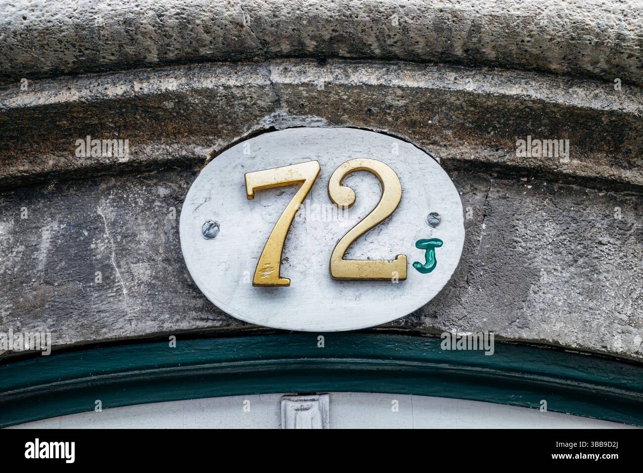 Ornate House Number Seventy-Two with Letter J. Close-up of an oval ...