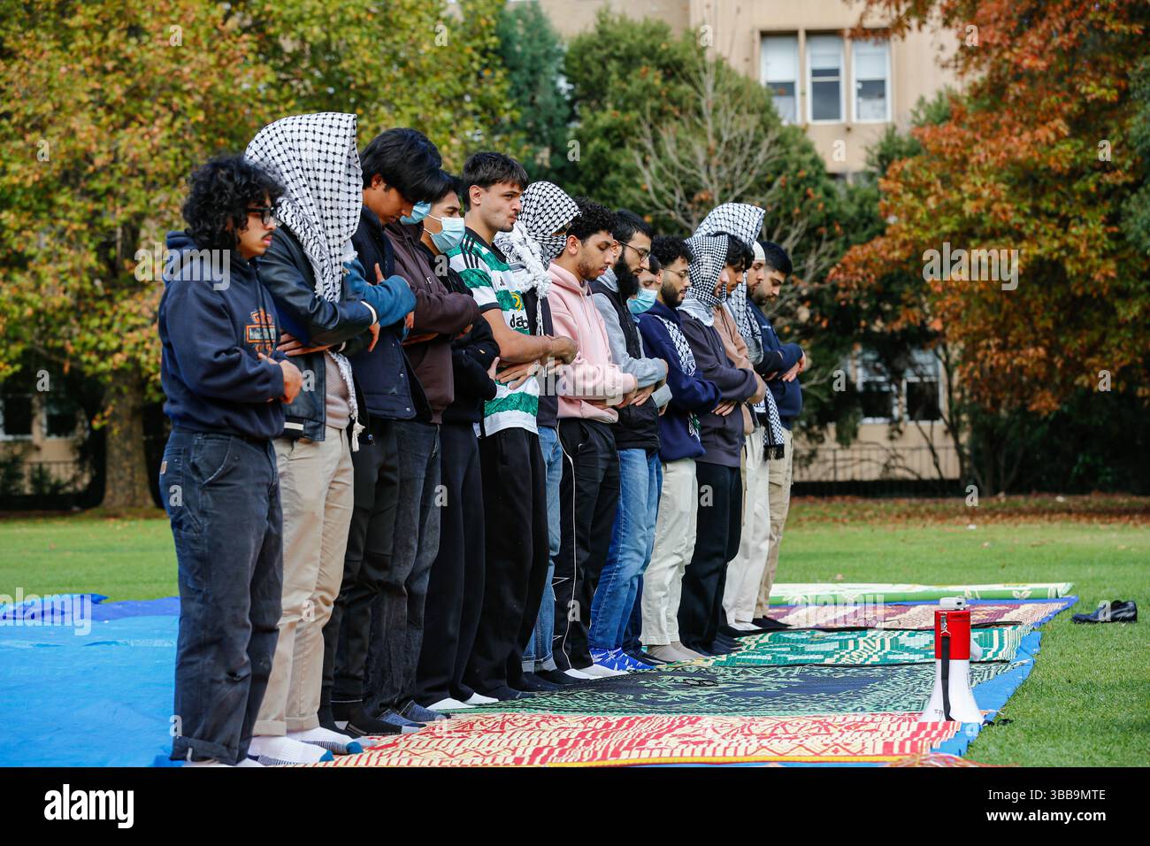 Muslim students pray before the rally. Students at the University of ...