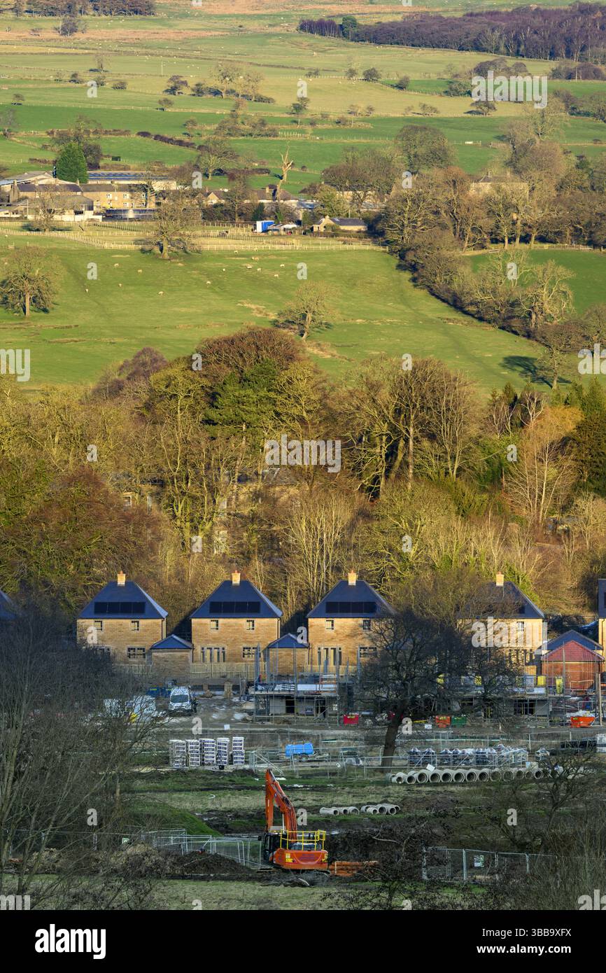 Building constructing houses in scenic rural valley (newly built, loss ...