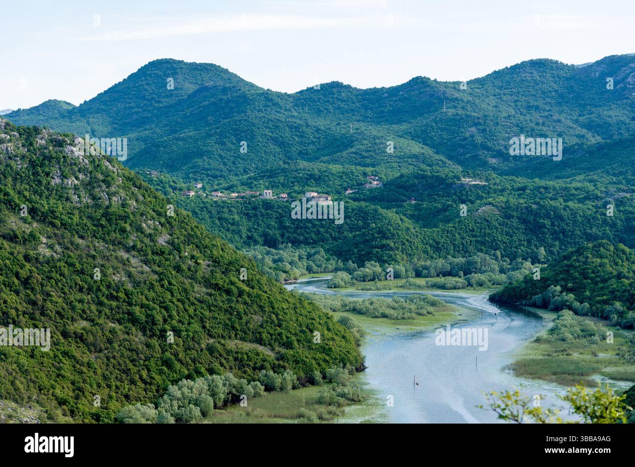 The Crnojevica River flows into Lake Skadar, summer mountains ...