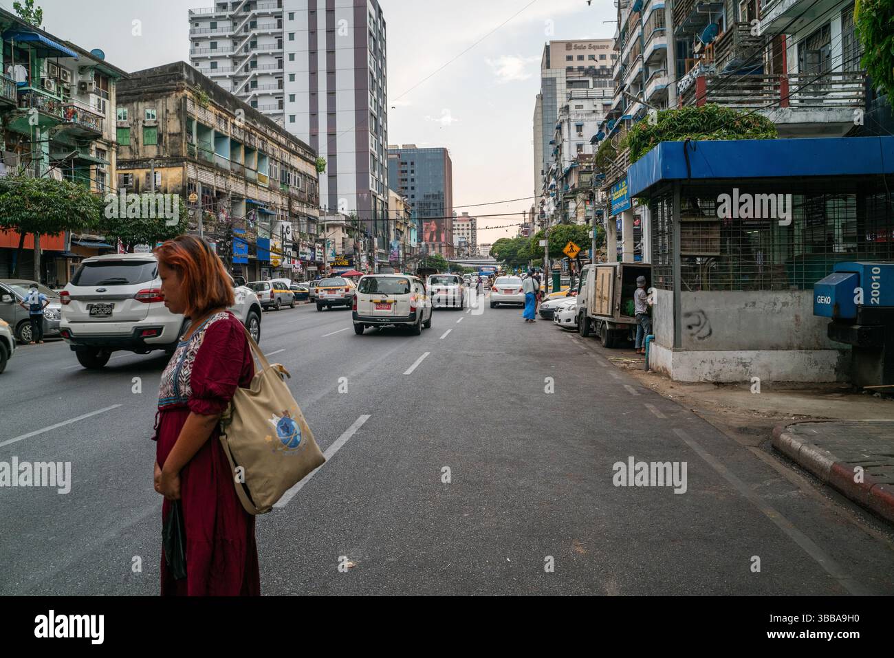 Yangon, Myanmar - 6 April, 2025: A typical street scene showing daily ...