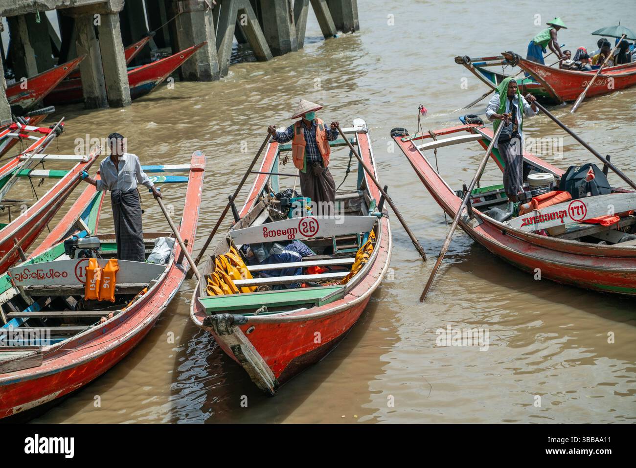 Yangon, Myanmar - 6 April, 2025: Various large and small boats are ...