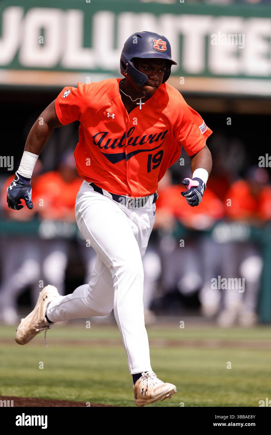Auburn Tigers left fielder Bub Terrell (19) hustles to first base ...