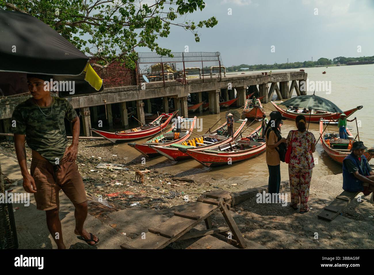 Yangon, Myanmar - 6 April, 2025: Various large and small boats are ...